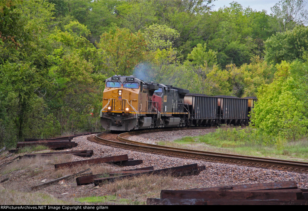 UP 7234 leads a loaded coal train Eb into jeff city,